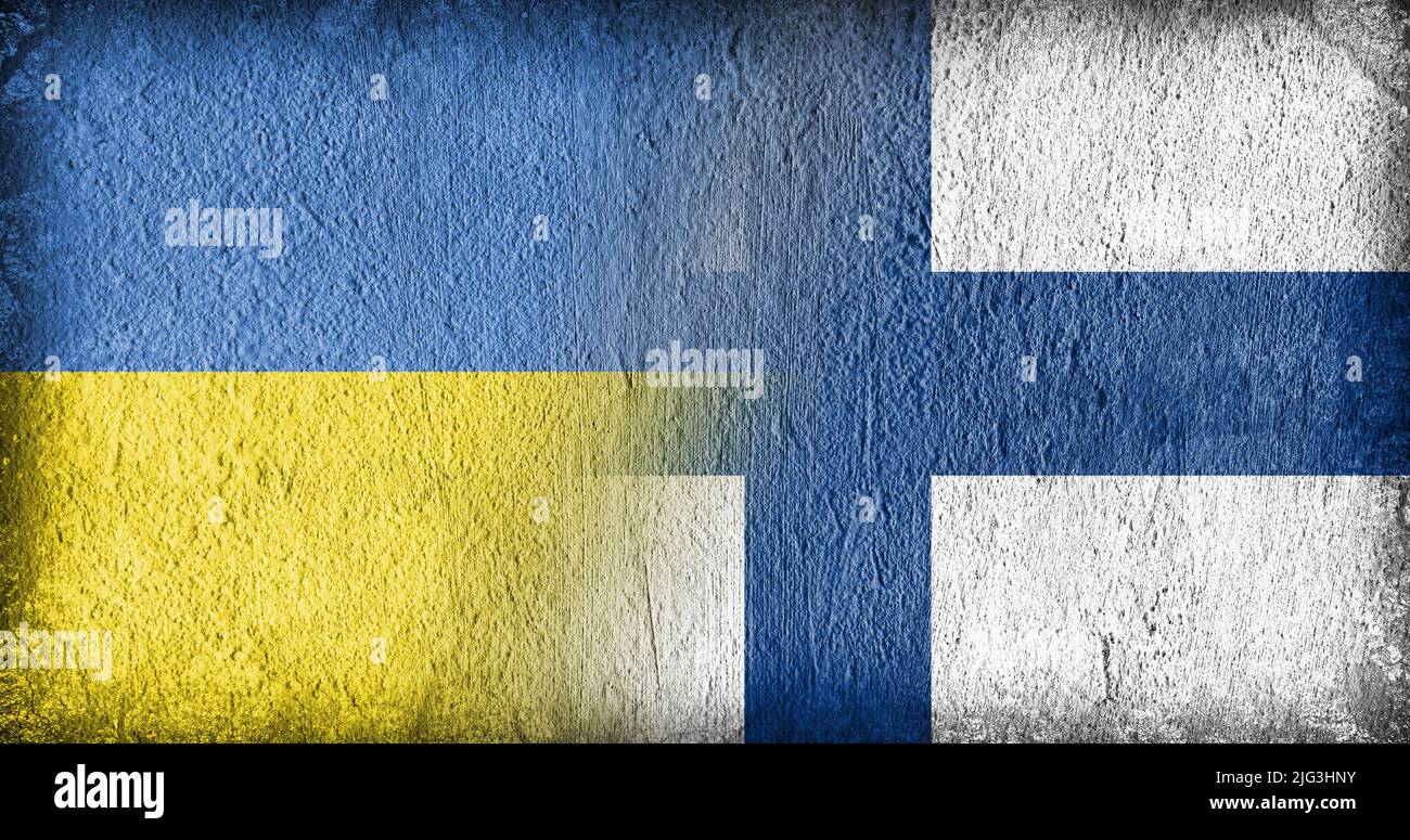 Ukrainian and Finnish flag on concrete, divided in the middle Stock ...