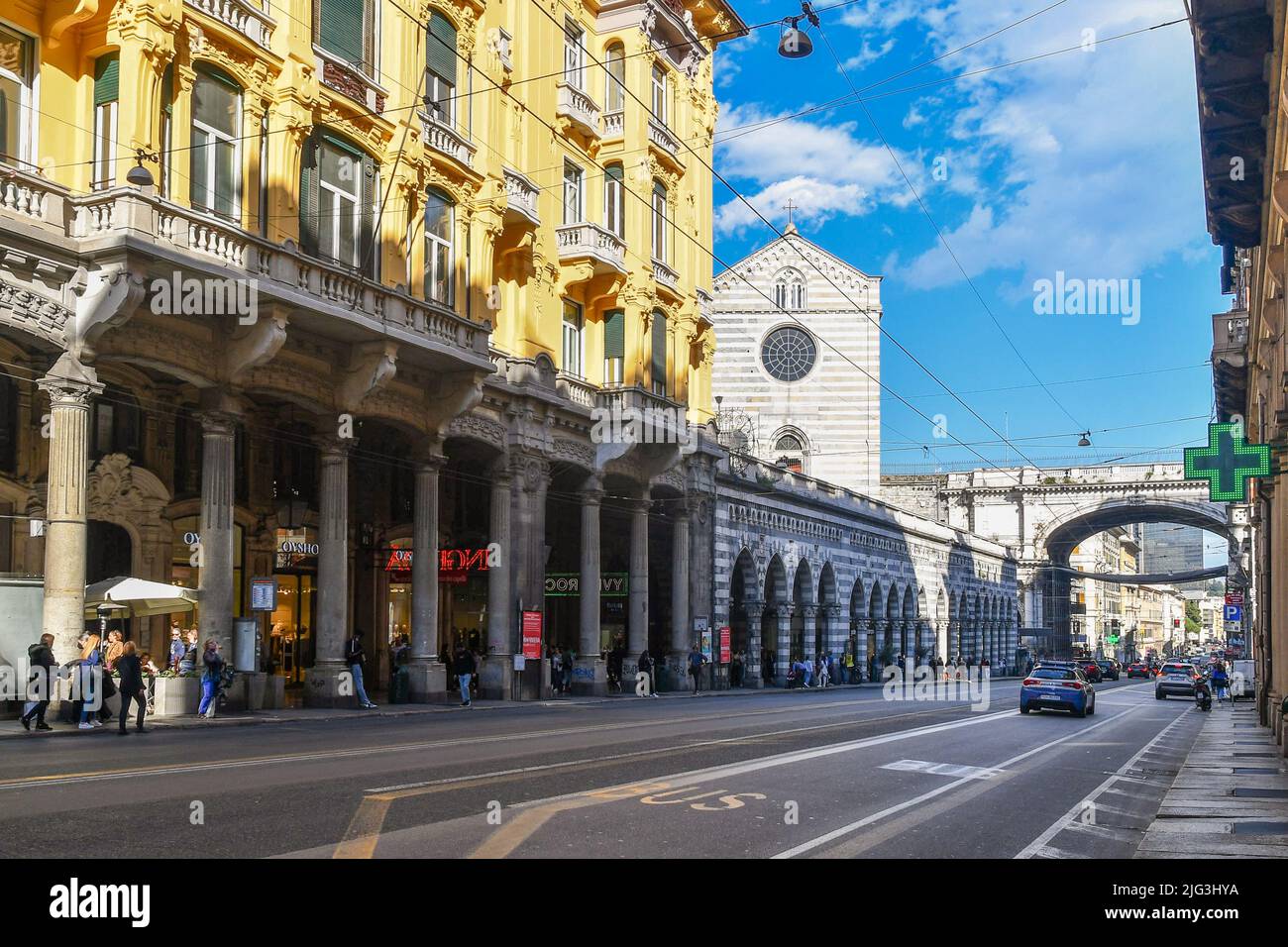 Street view of Via XX Settembre in the city centre with the Church of ...
