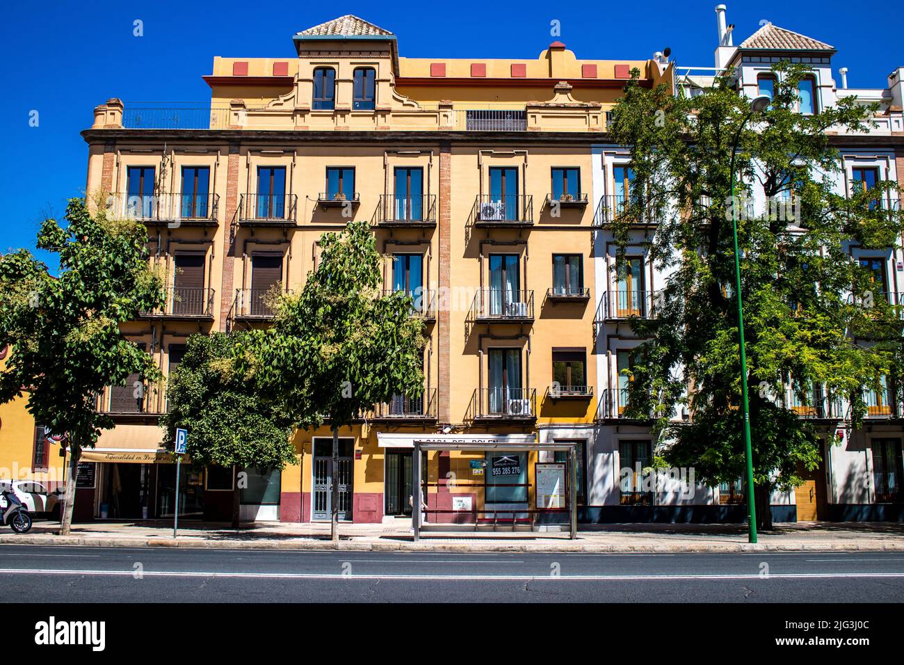 Seville, Spain - July 04, 2022 Facade of a building in the streets of ...