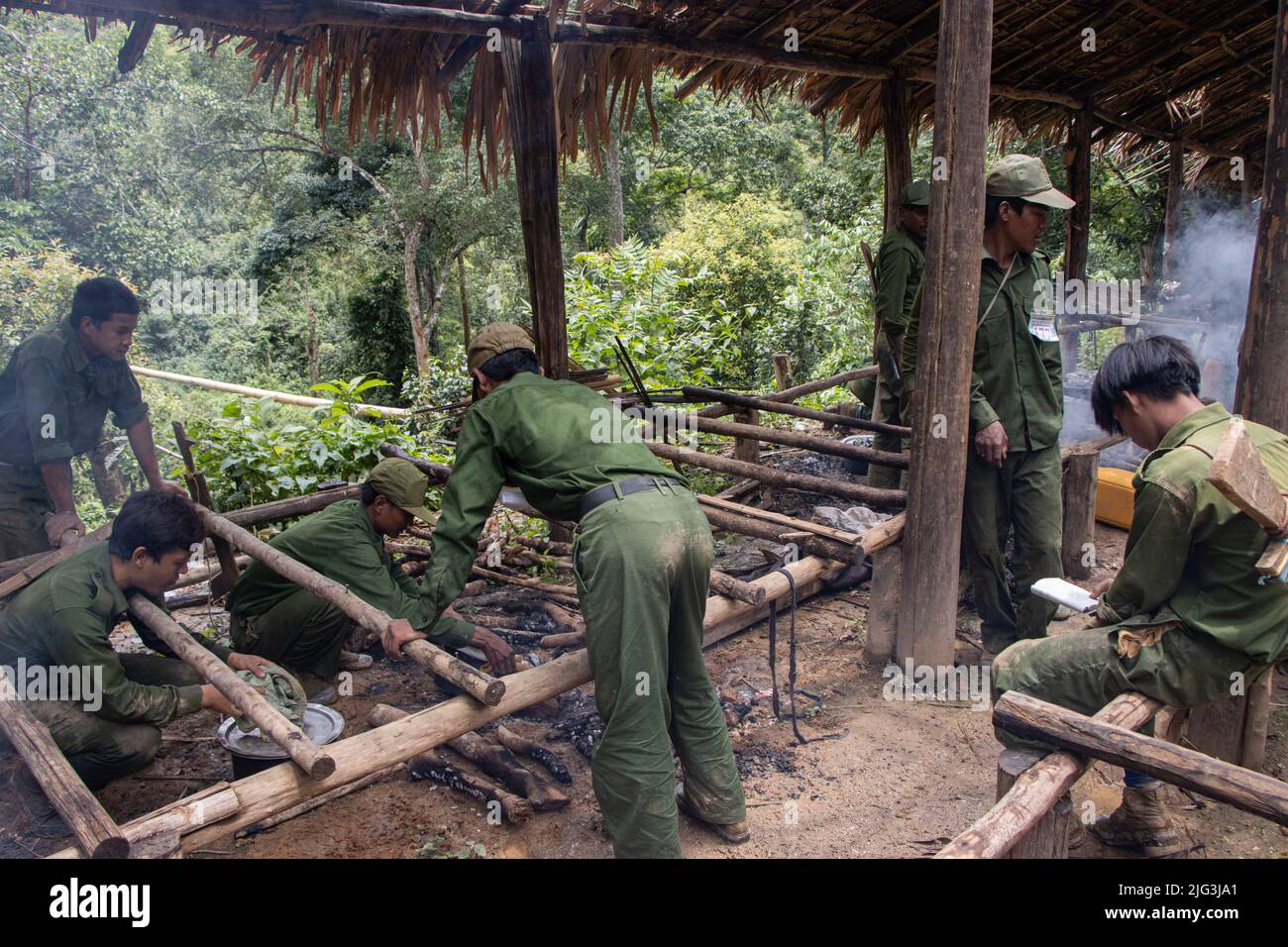 Members of the Mandalay People's Defence are cooking at their camp. The ...