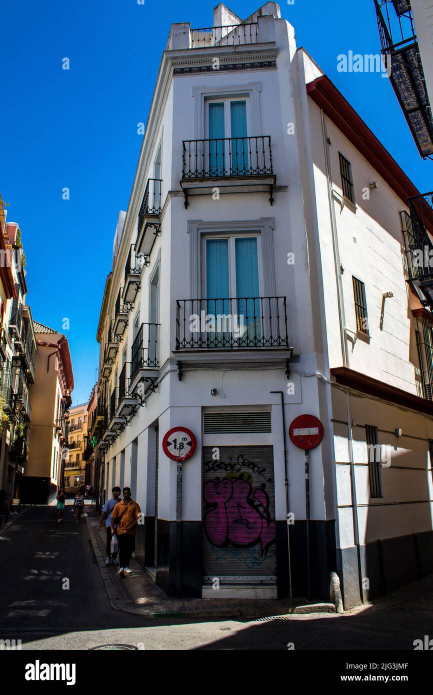 Seville, Spain - July 04, 2022 Facade of a building in the streets of ...