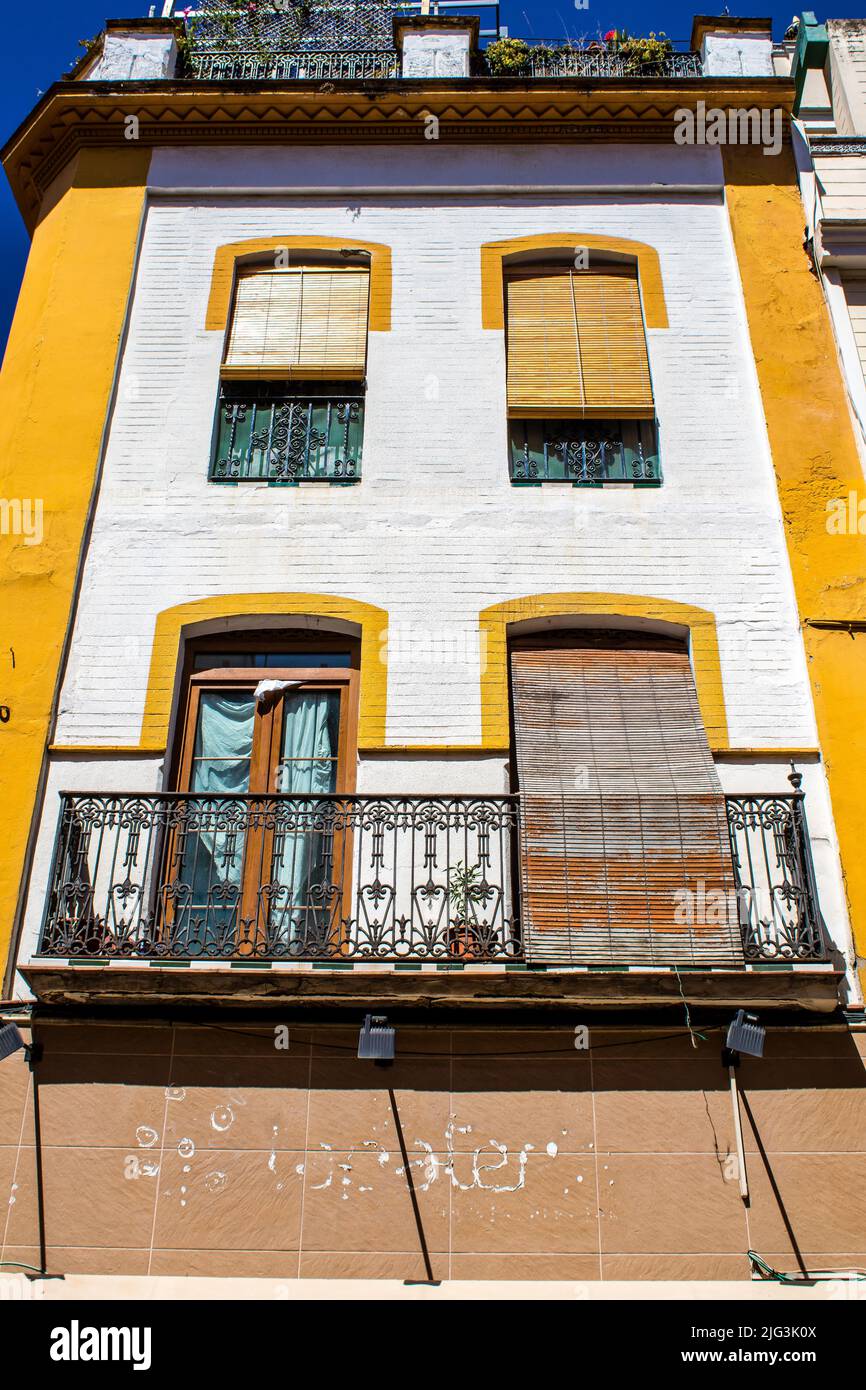 Seville, Spain - July 04, 2022 Facade of a building in the streets of ...