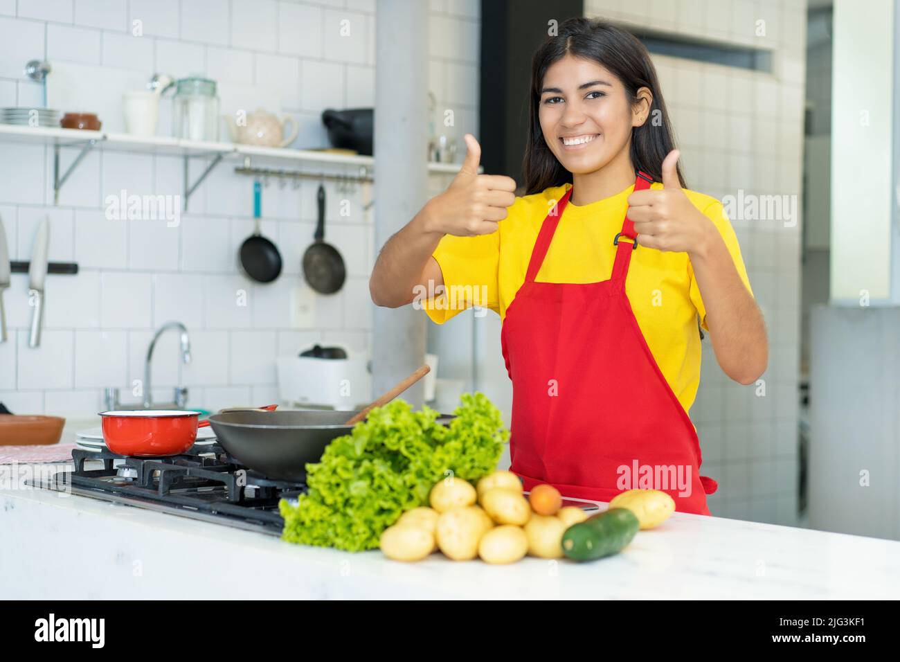 Young hispanic woman chef hi-res stock photography and images - Alamy