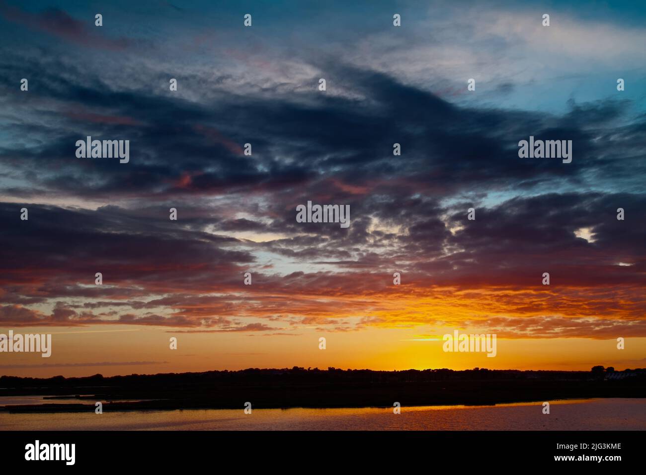 Sunset Over Stanpit Marsh Nature Reserve And Christchurch Town, uk ...