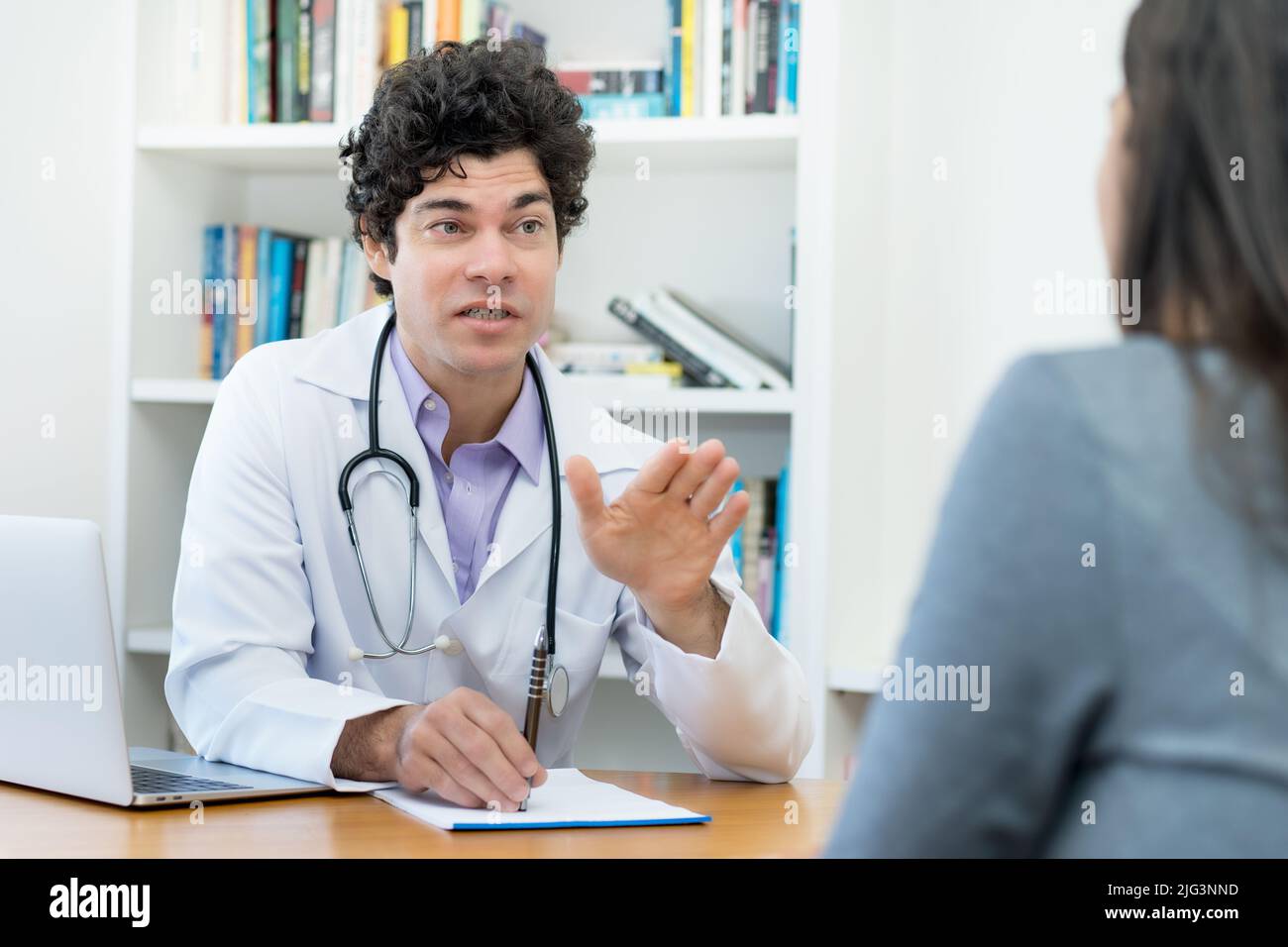 Worried Doctor Talking With Female Patient About Her Health At Office