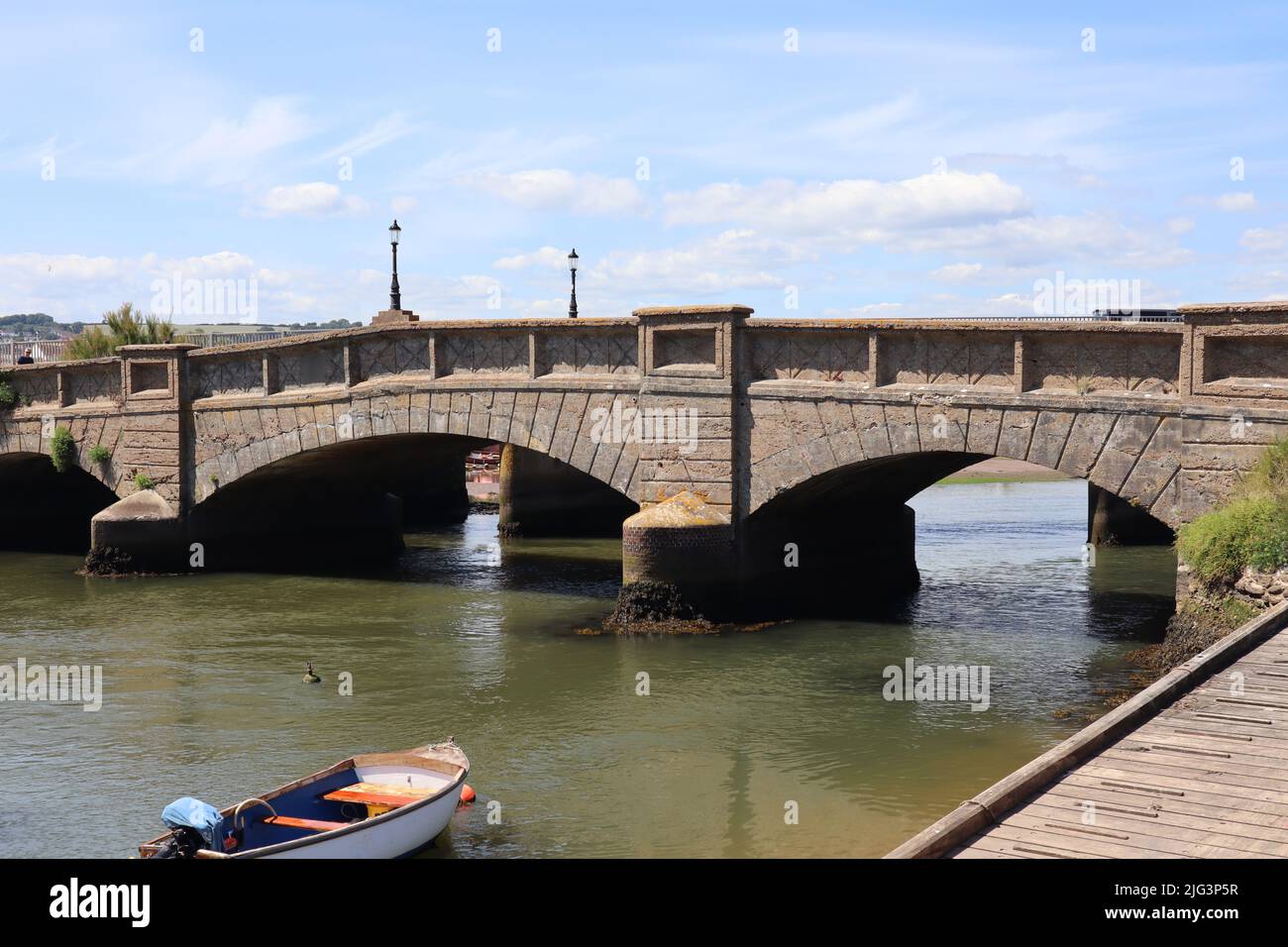 The old road bridge across the River Axe at Axmouth. It was replaced in ...