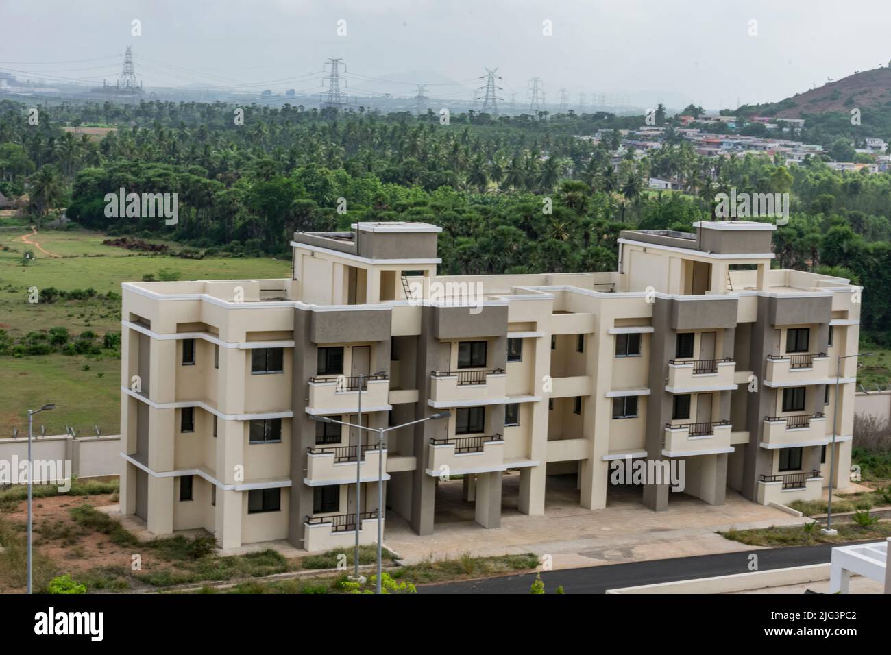 Top view of an Indian colony with bitumen road , building looking in ...