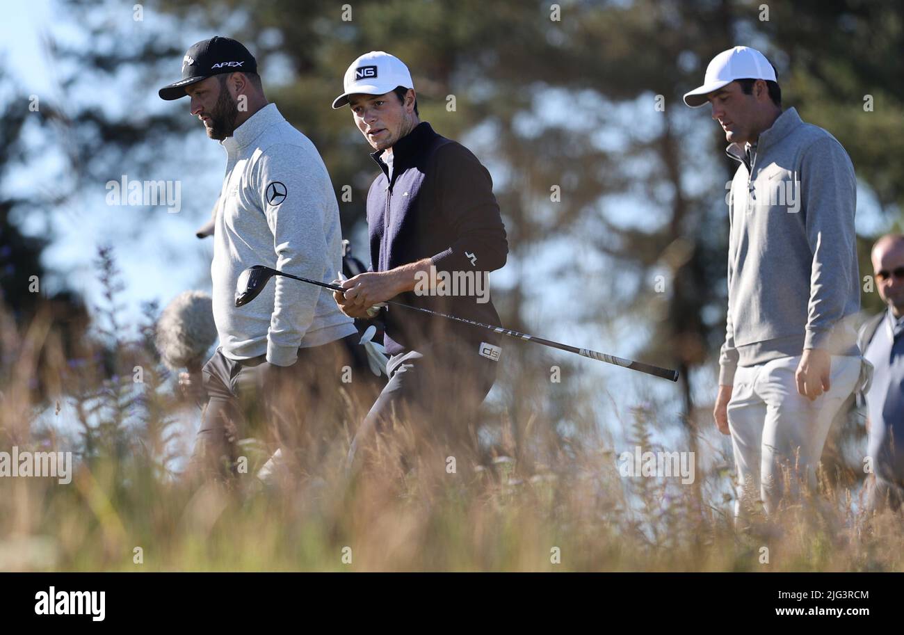 Viktor Hovland (centre) and Jon Rahm (left) during day one of the ...