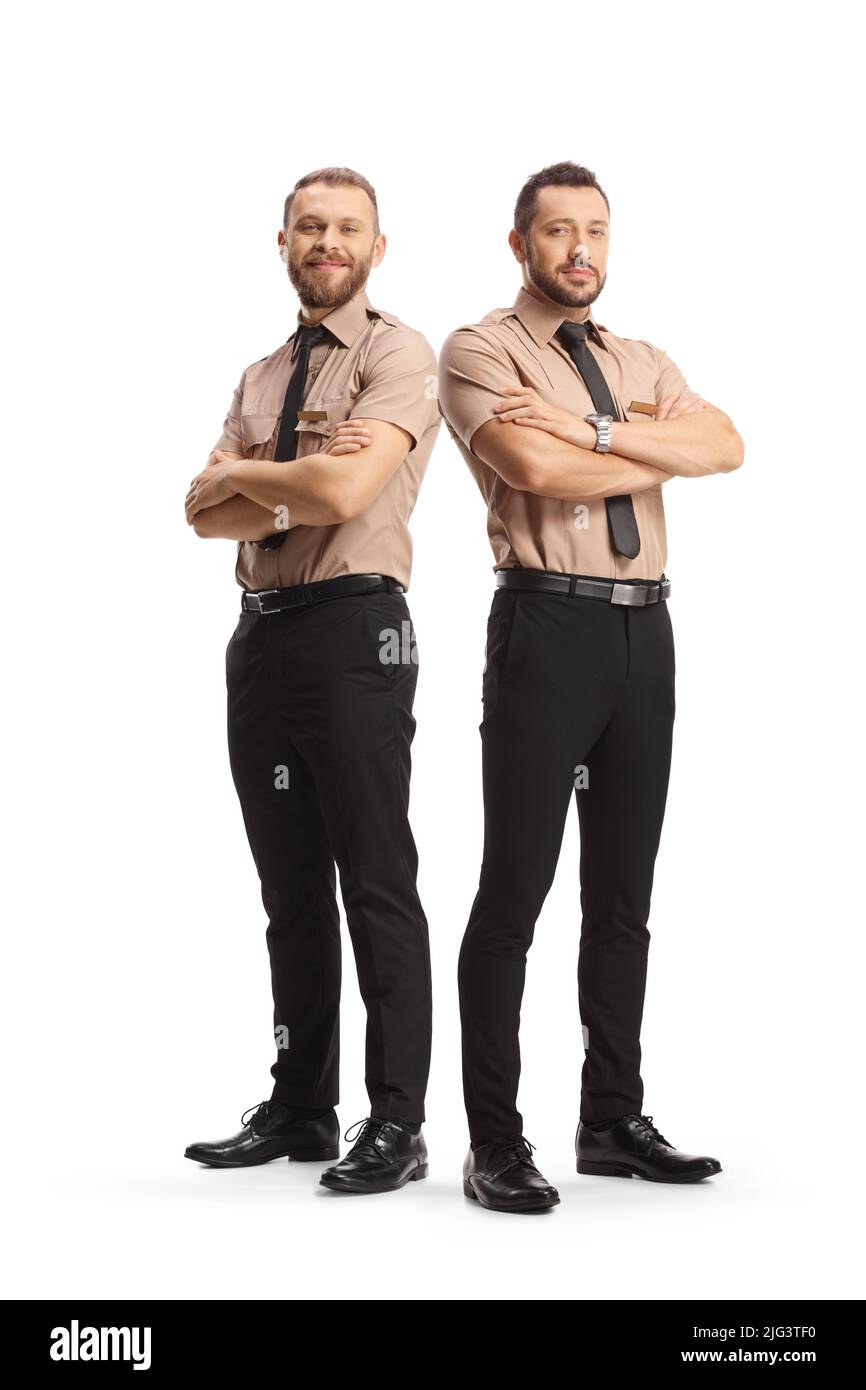 Full length portrait of two security guards posing with crossed arms ...