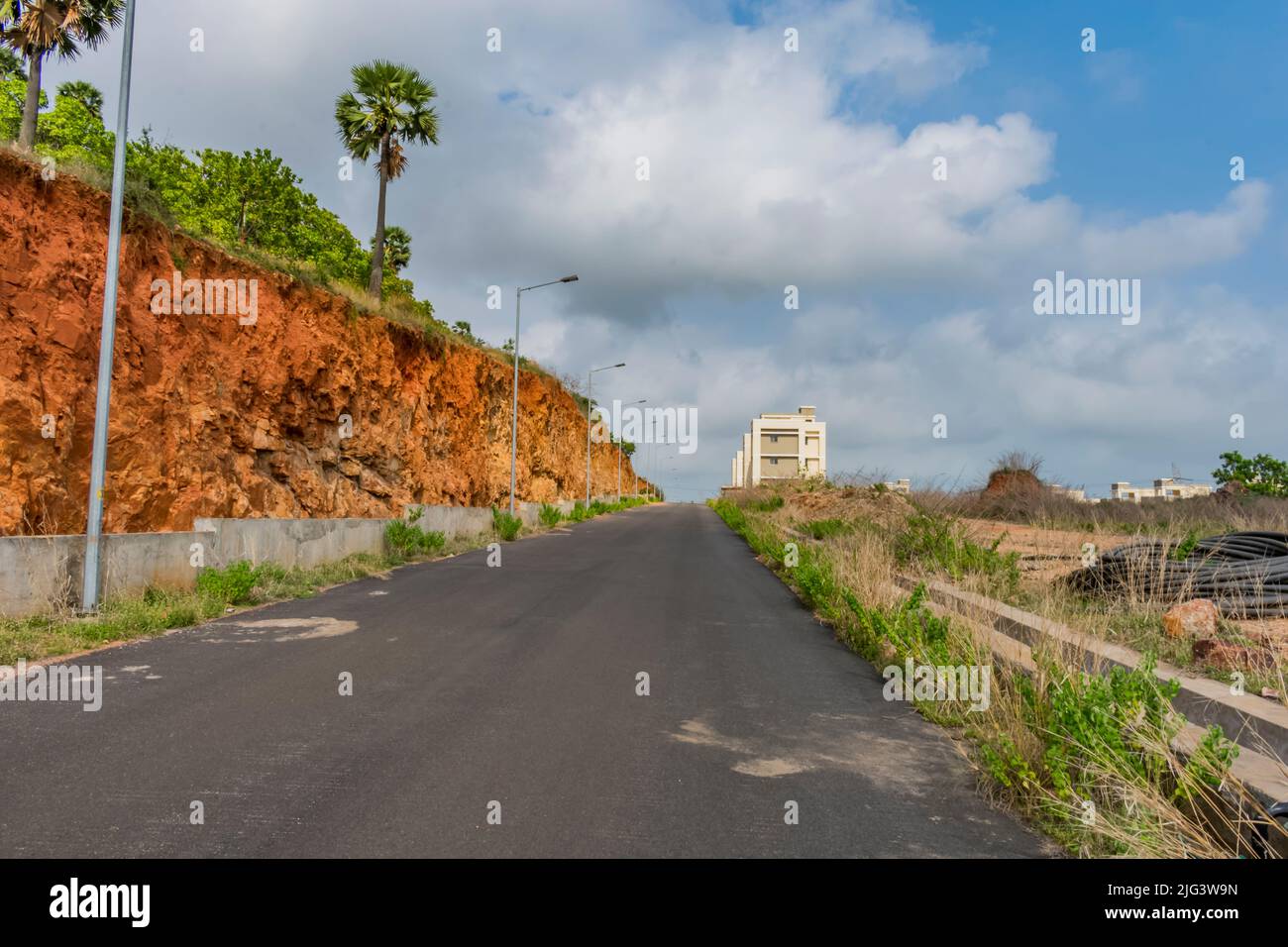 Awesome view of colony & blue sky scenery from a top of a mountain road ...