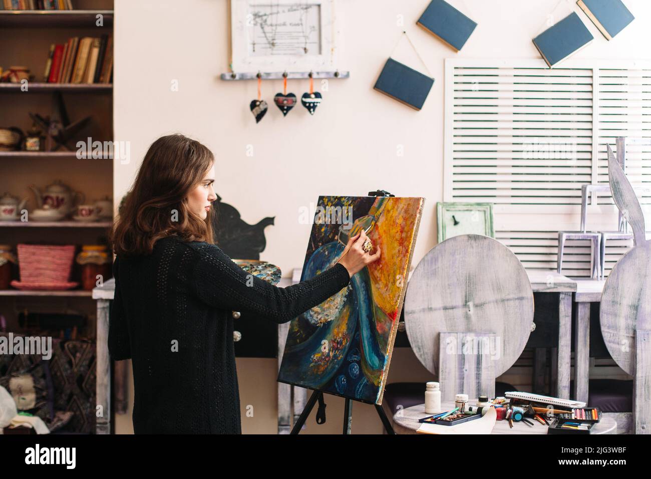 Artist creates abstract painting in workshop Stock Photo - Alamy