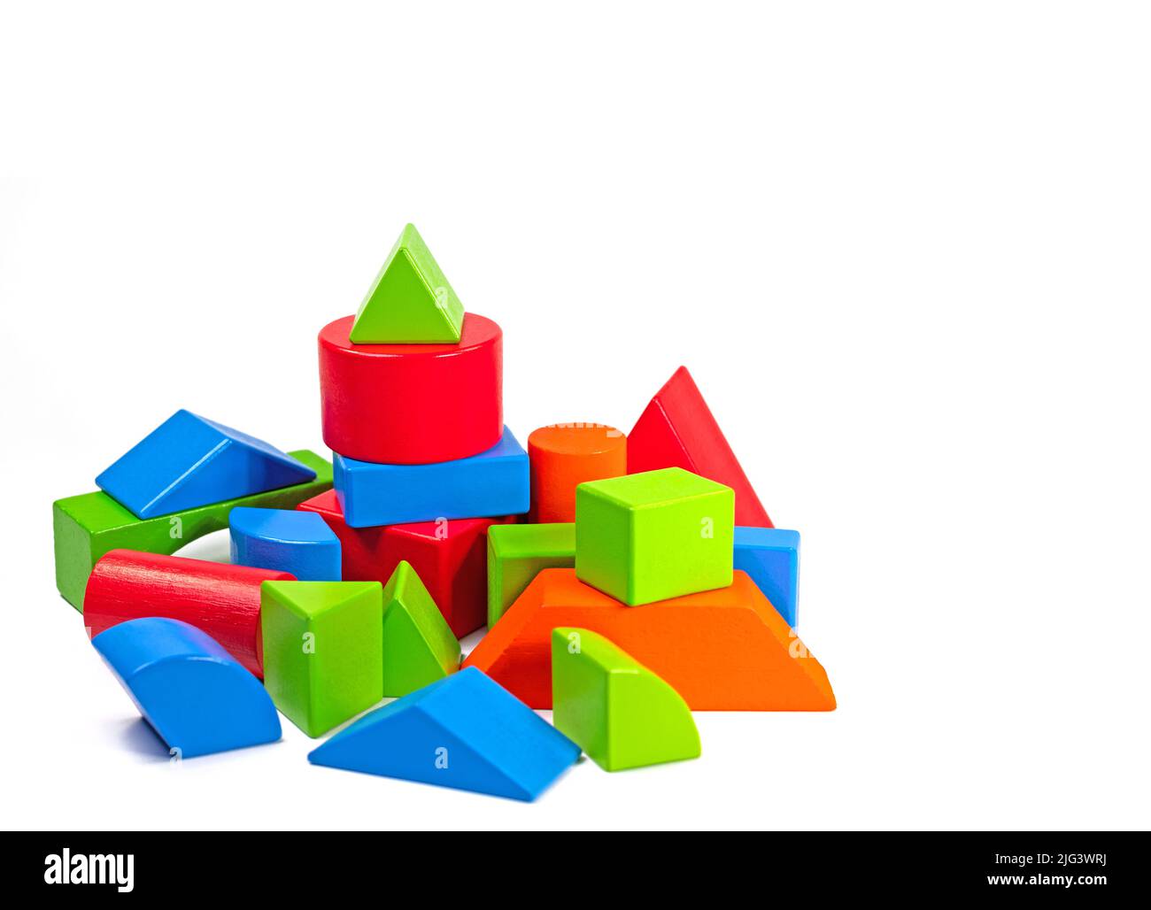 Wooden building blocks of different shapes and colors against a white ...