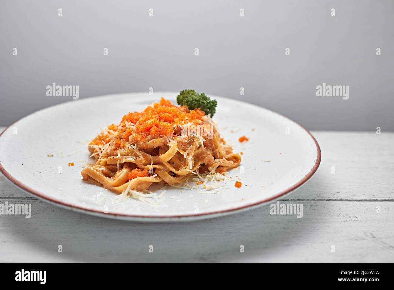 creamy sauce pasta with ebiko , selective focus Stock Photo - Alamy