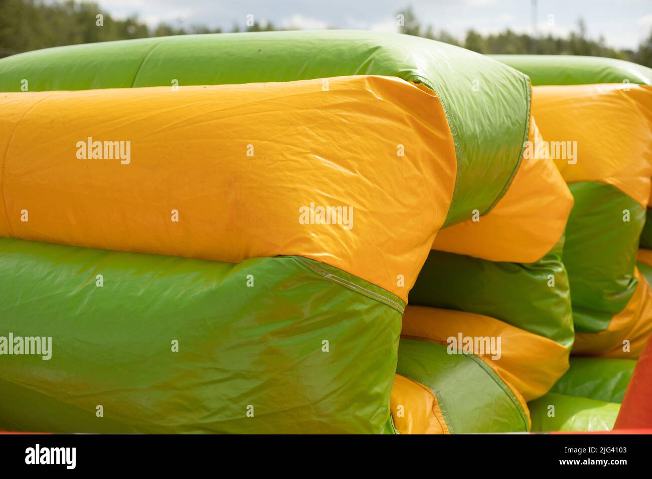 Inflatable construction in amusement park. Obstacle course for children ...