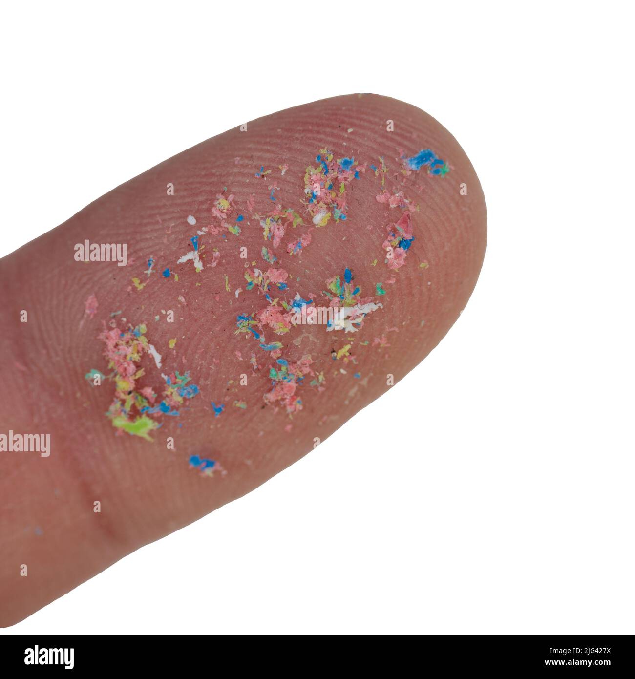 Finger macro close-up with traces of plastic, microplastic ...