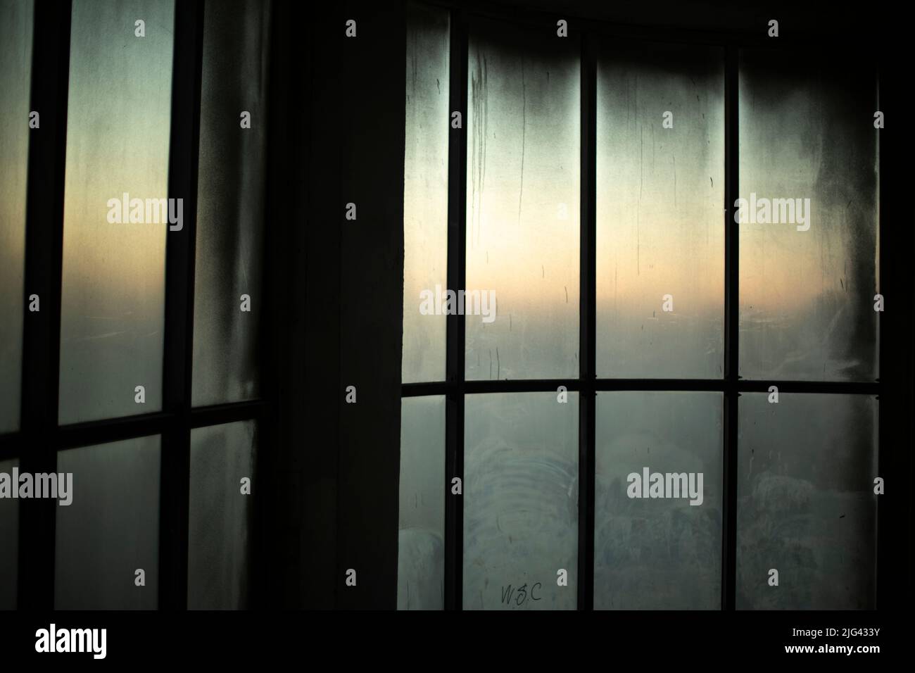Inside tunnel. Window details. Light in city building. Glass in dust ...