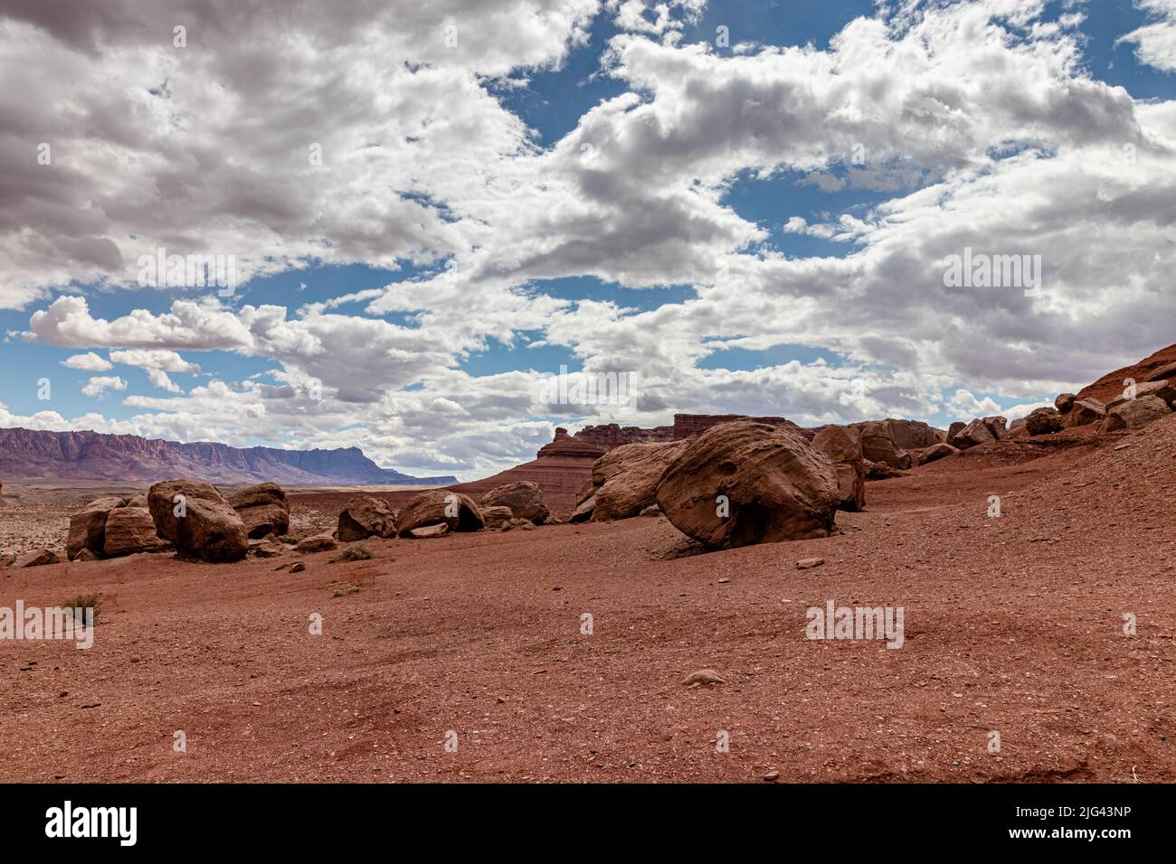 The mountain range seen besides the boulders, Vermillion cliff range ...