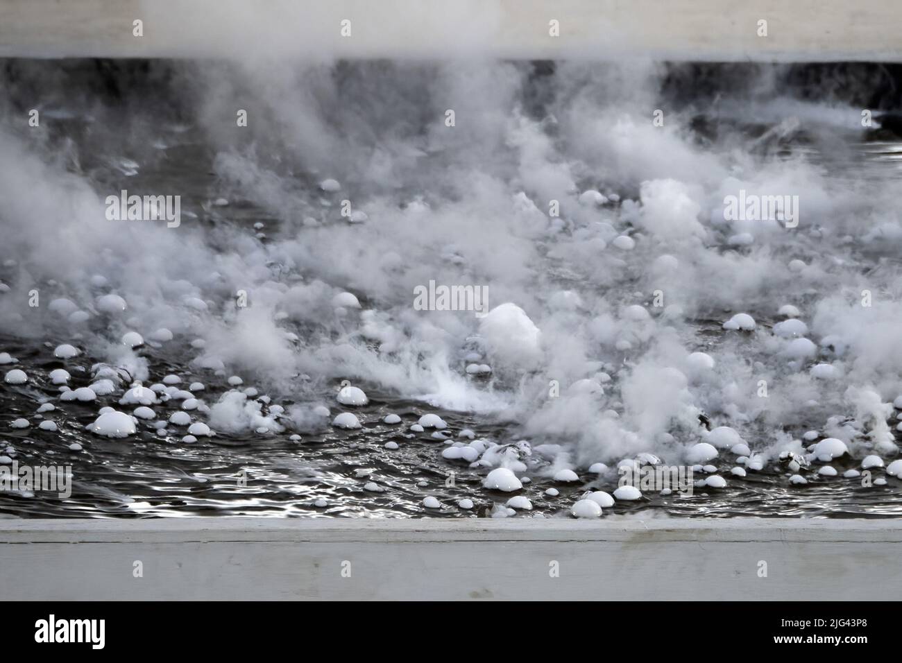 solid co2 in water making bubbles detail frozen ice smoke Stock Photo ...