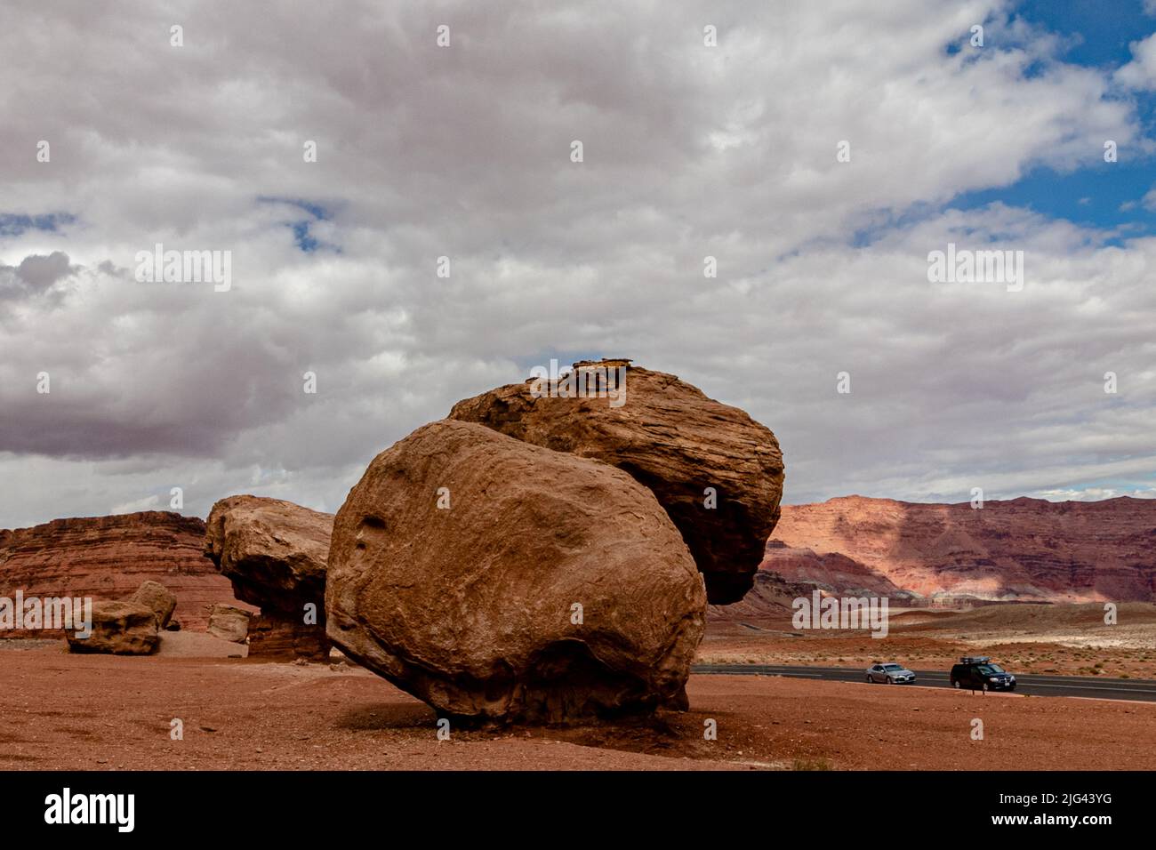 Giant boulders shown with human cars for comparison by the side of the ...