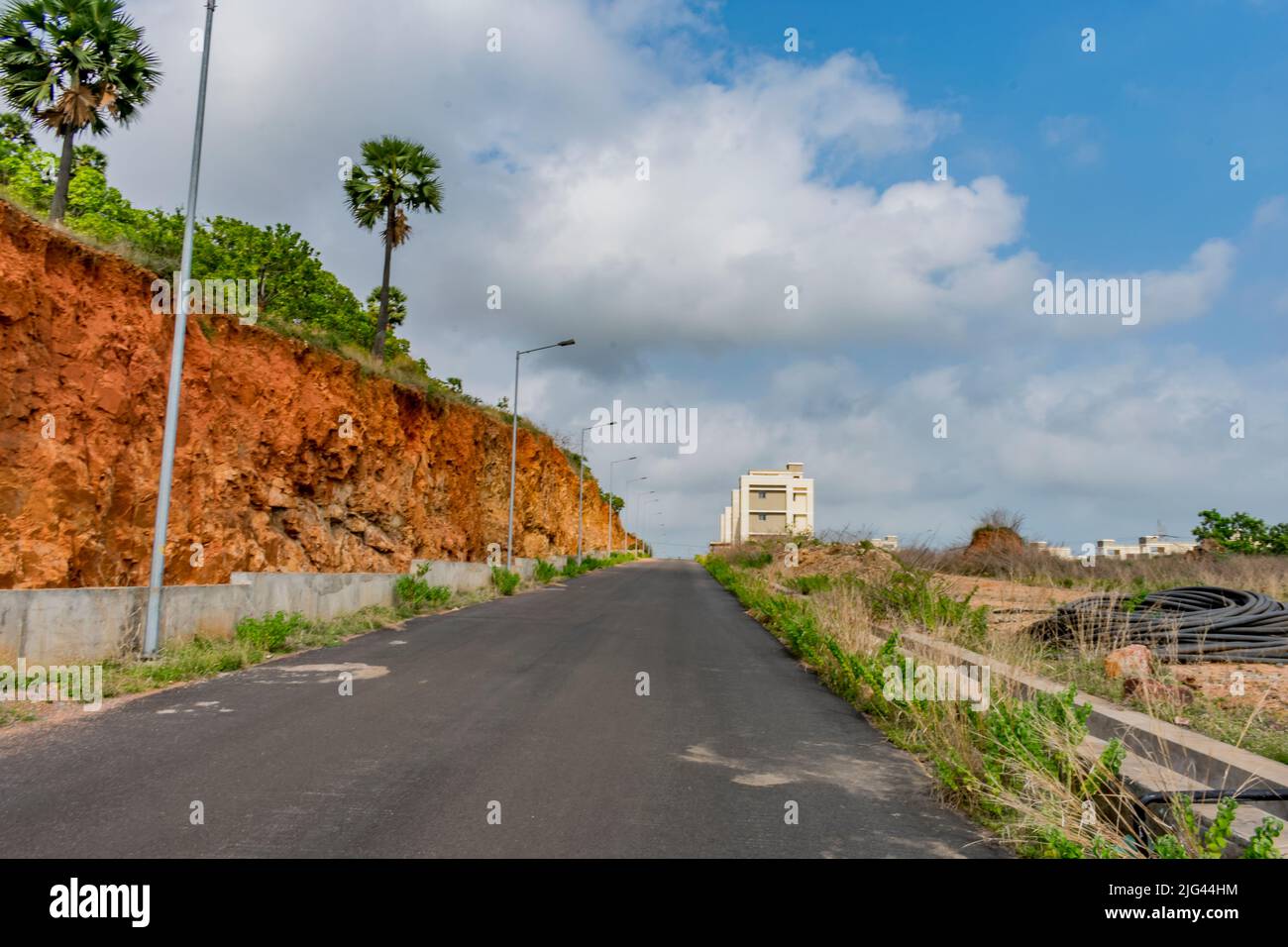 Awesome view of colony & blue sky scenery from a top of a mountain road ...