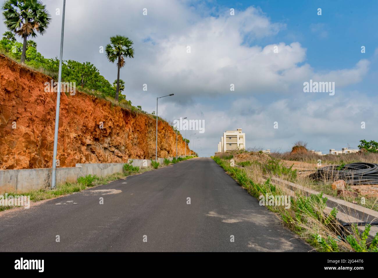 Awesome view of colony & blue sky scenery from a top of a mountain road ...
