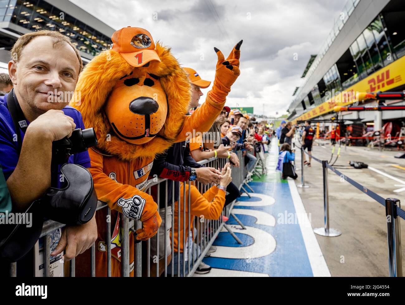 SPIELBERG - Fans of Max Verstappen watch the pitlane on the Red Bull ...
