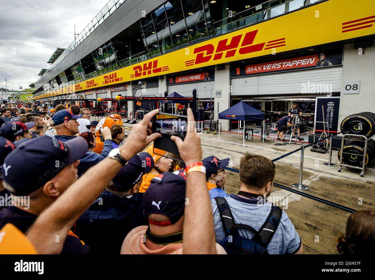 SPIELBERG - Fans of Max Verstappen watch the pitlane on the Red Bull ...