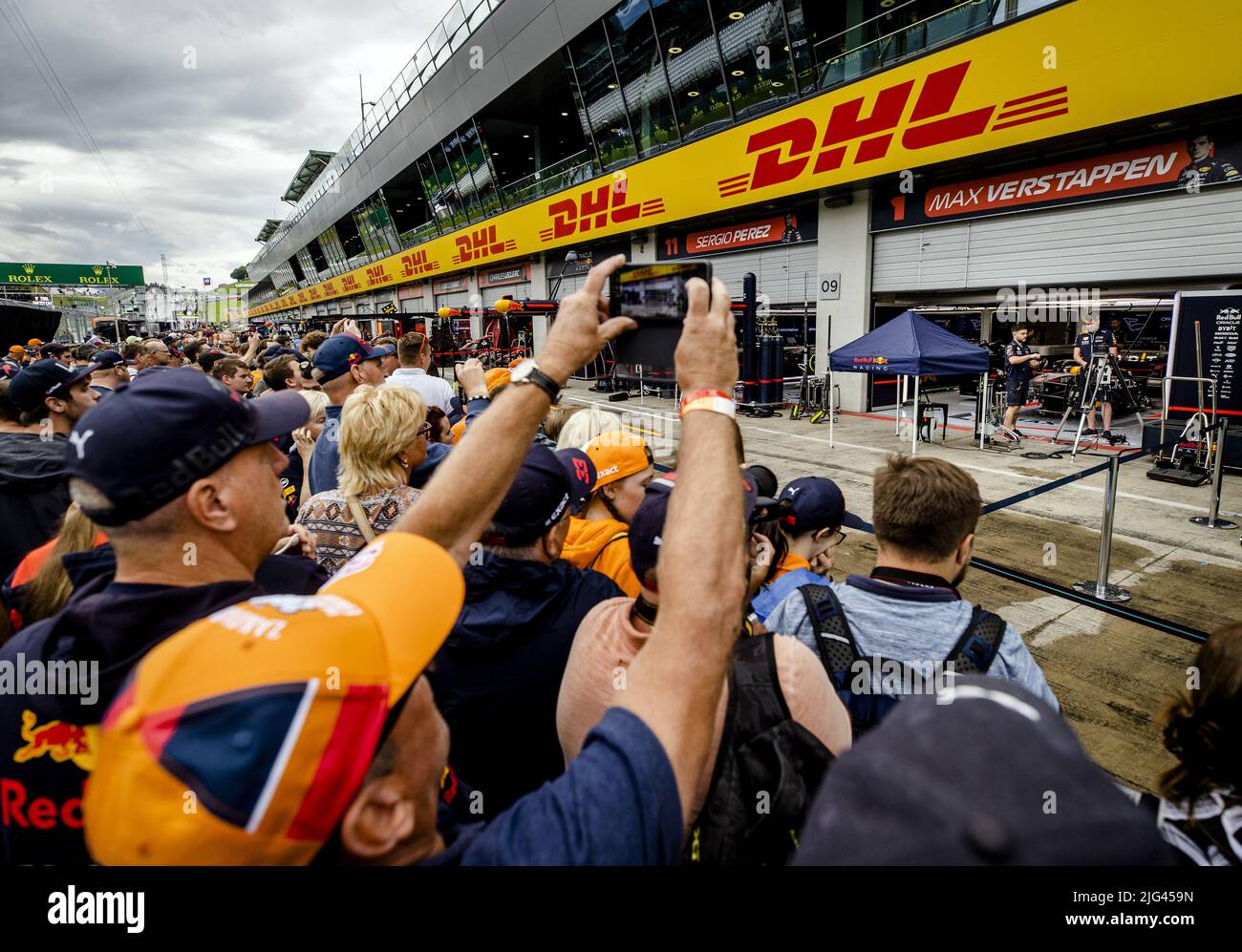 SPIELBERG - Fans of Max Verstappen watch the pitlane on the Red Bull ...