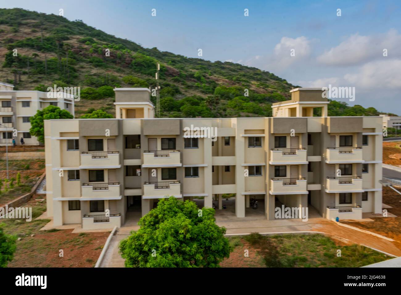 Top view of an Indian colony with bitumen road , building looking in ...