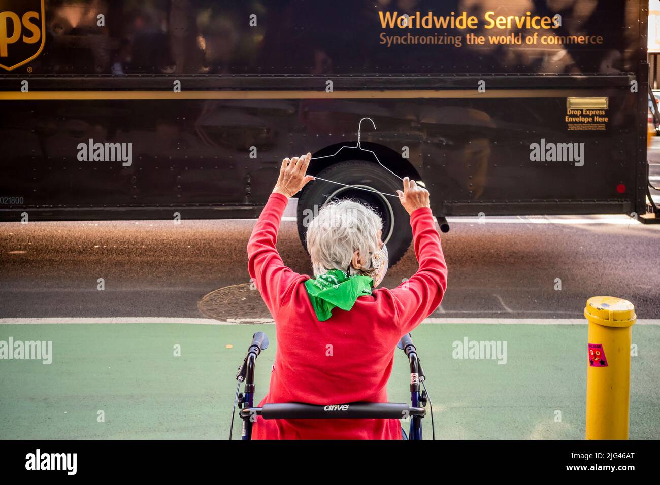 A senior citizen in Chelsea in New York protests the Supreme Court ...