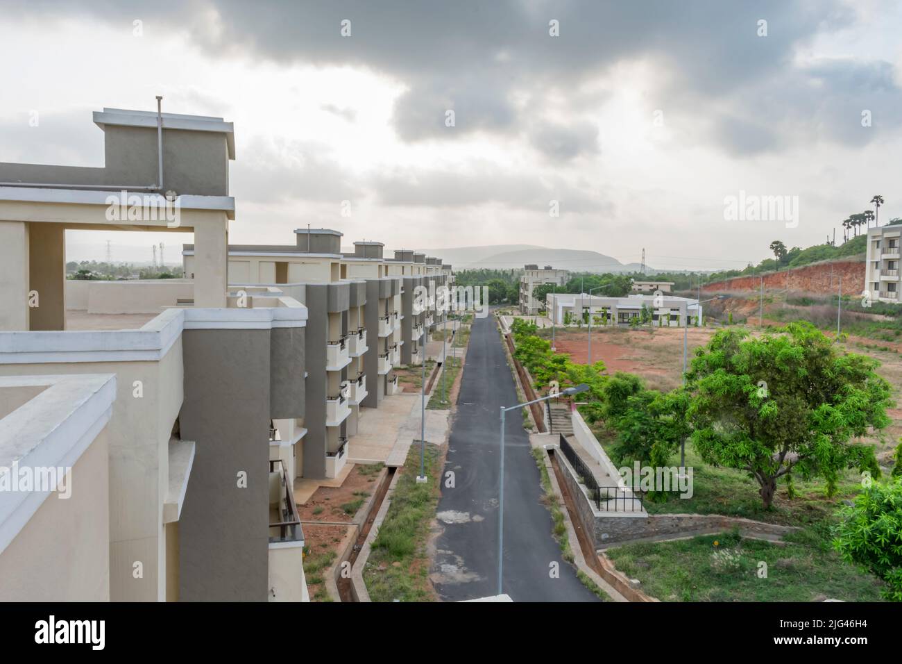 Top view of an Indian colony with bitumen road , building looking in ...