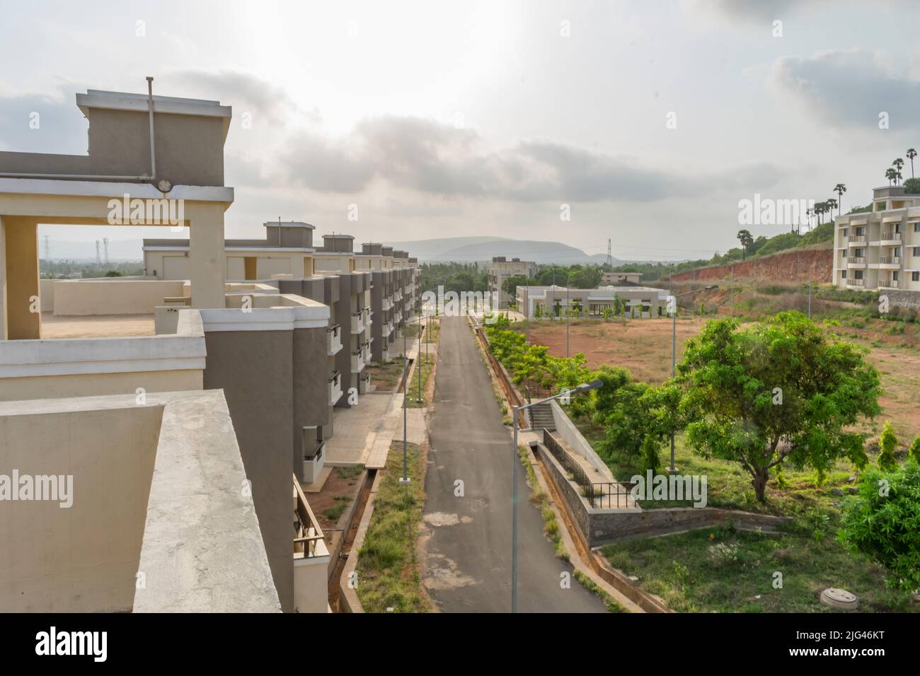 Top view of an Indian colony with bitumen road , building looking in ...