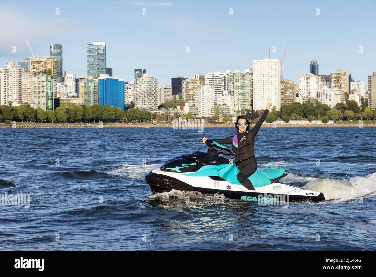 Adventurous Caucasian Woman on Sea-Doo riding in the Ocean Stock Photo ...