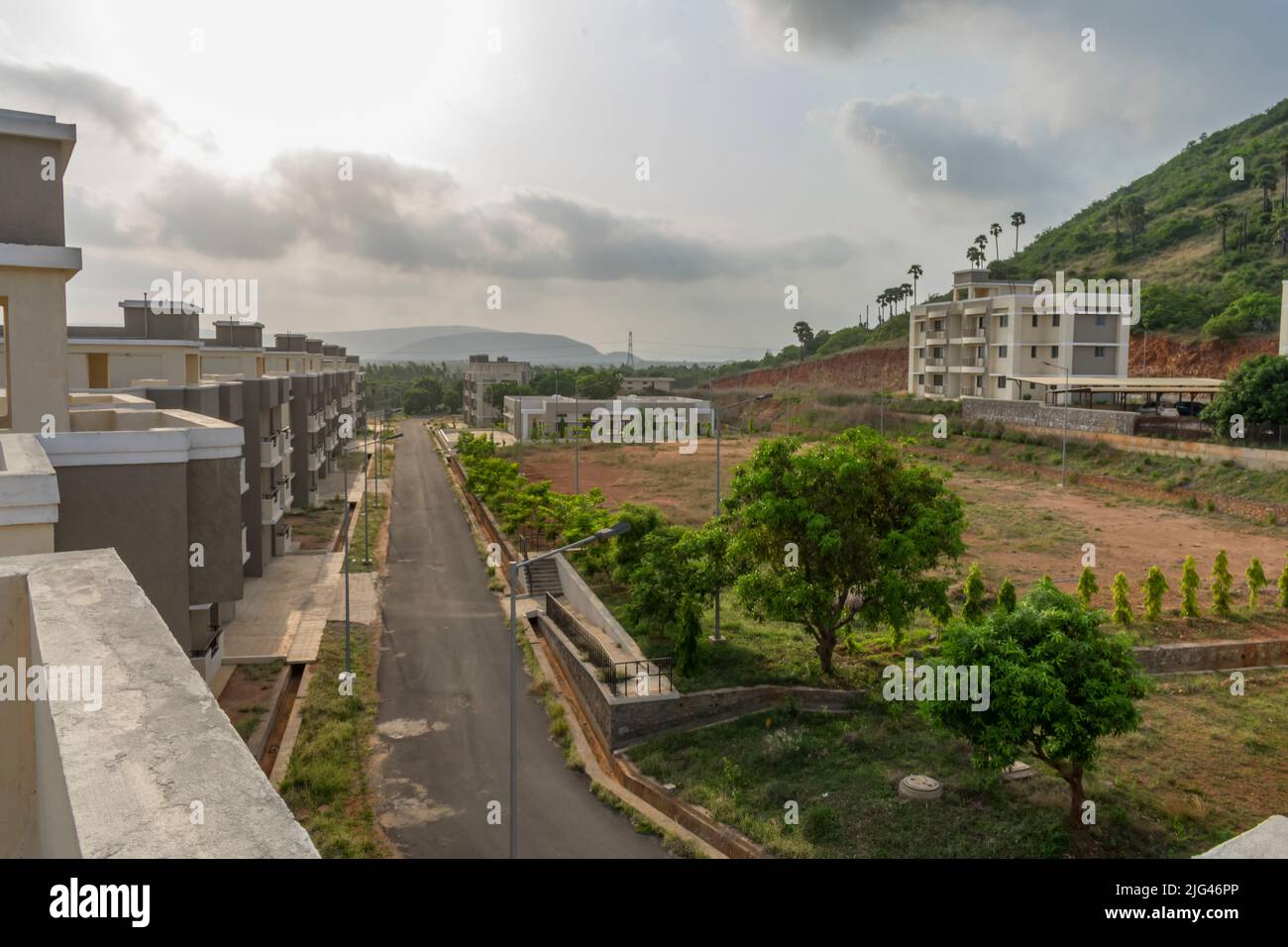 Top view of an Indian colony with bitumen road , building looking in ...