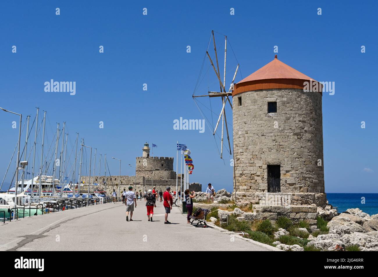 Rhodes, Greece - May 2022: Traditional stone windmills on the town's ...
