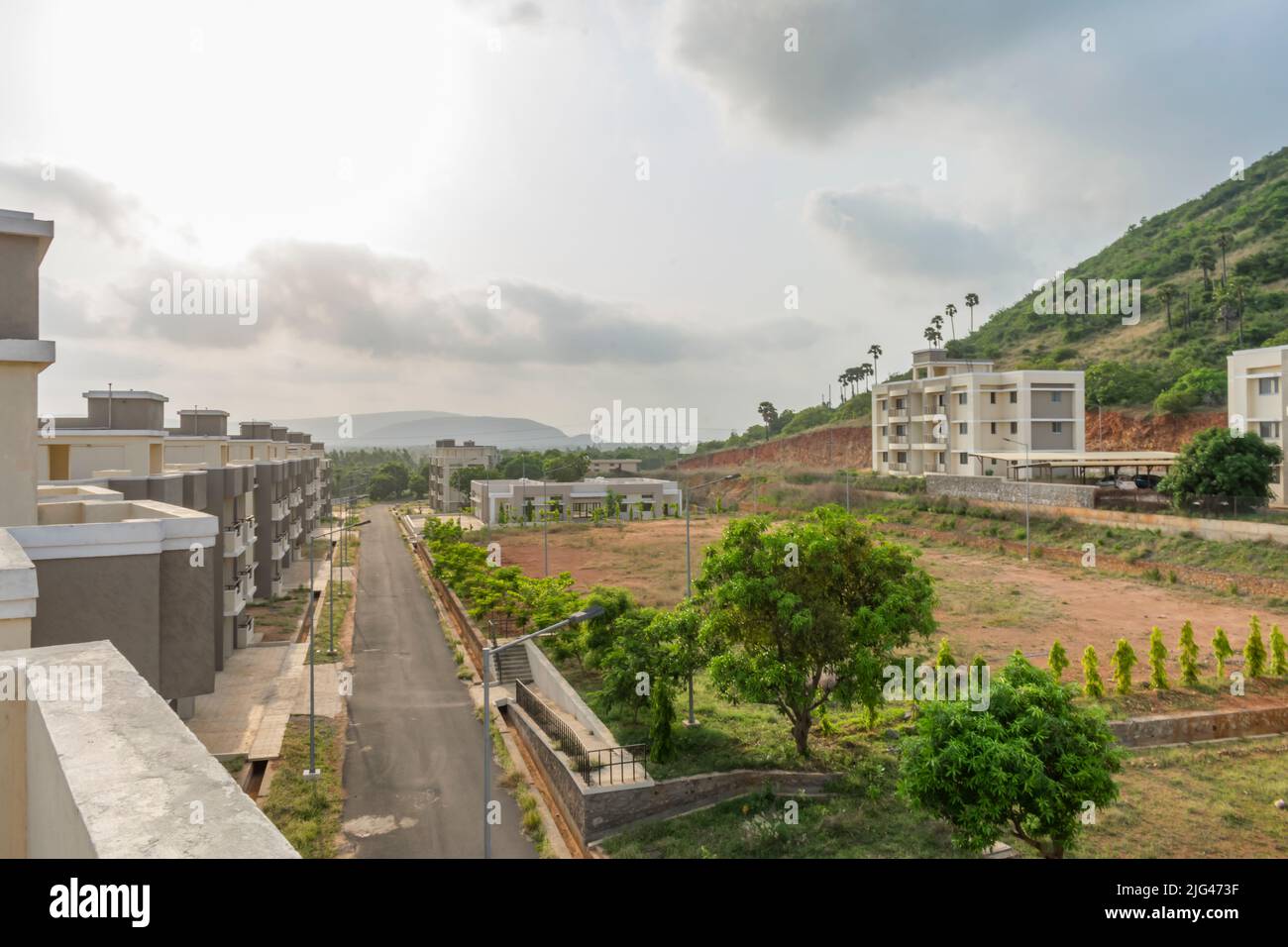 Top view of an Indian colony with bitumen road , building looking in ...