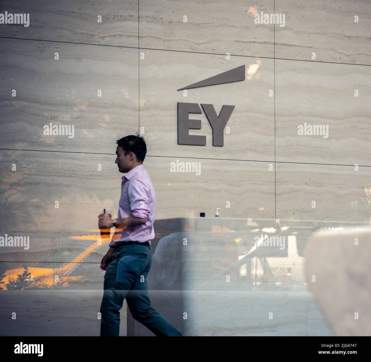 The logo of the accounting firm Ernst & Young (EY) is seen on the wall ...