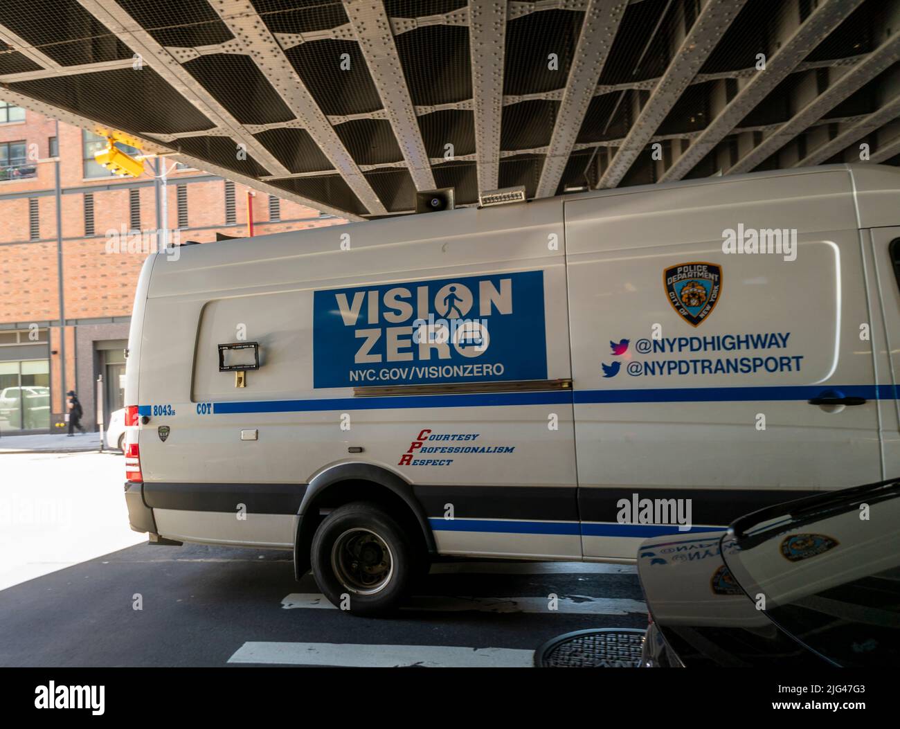 An NYPD van decorated with Vision Zero promotional signage in the ...
