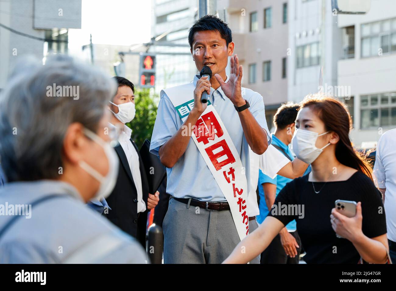 Kentaro Asahi delivers a street speech outside Tokyo Dome on July 7 ...