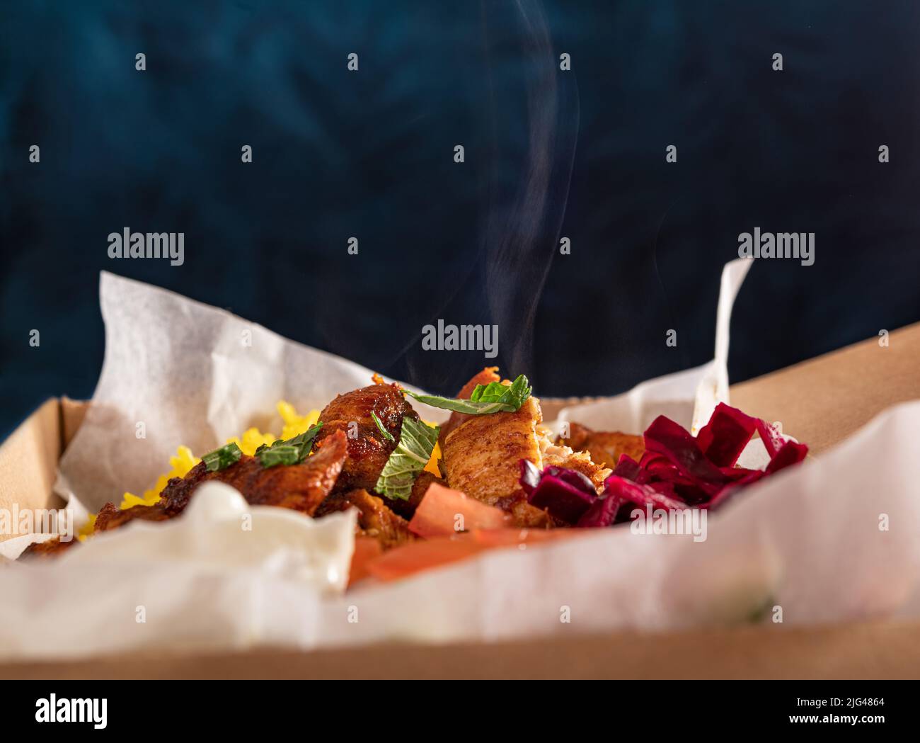 Traditional Eastern Mediterranean takeaway meal of grilled chicken ...