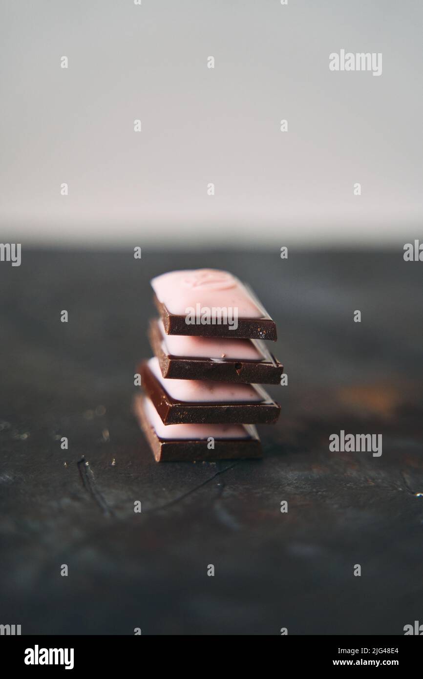Selective Focus on Four Chocolate Slices on a Dark Background Stock ...