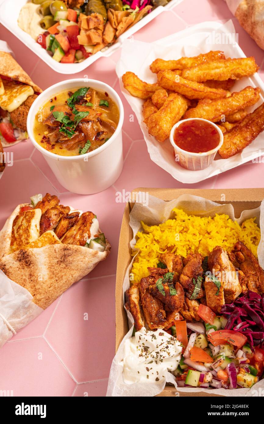 Variety of traditional takeaway Mediterranean Arabic meals for sharing ...