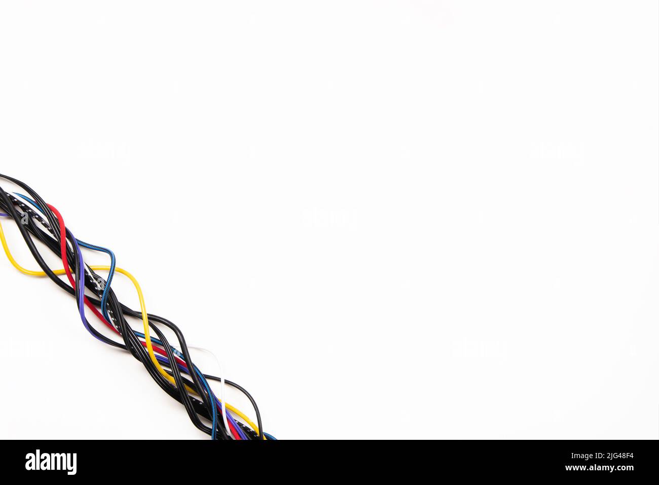 Many colorful electrical cord cables twist together into single frame ...