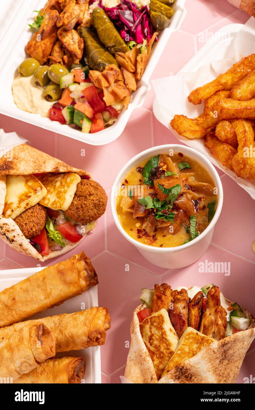 Variety of traditional takeaway Mediterranean Arabic meals for sharing ...