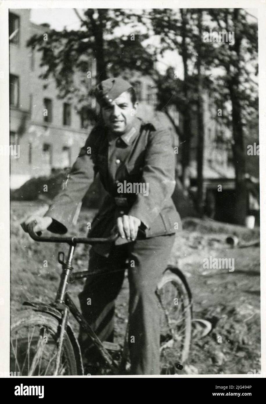 Portrait of divisional soldier by bicycle. Divisionary with warrior and ...