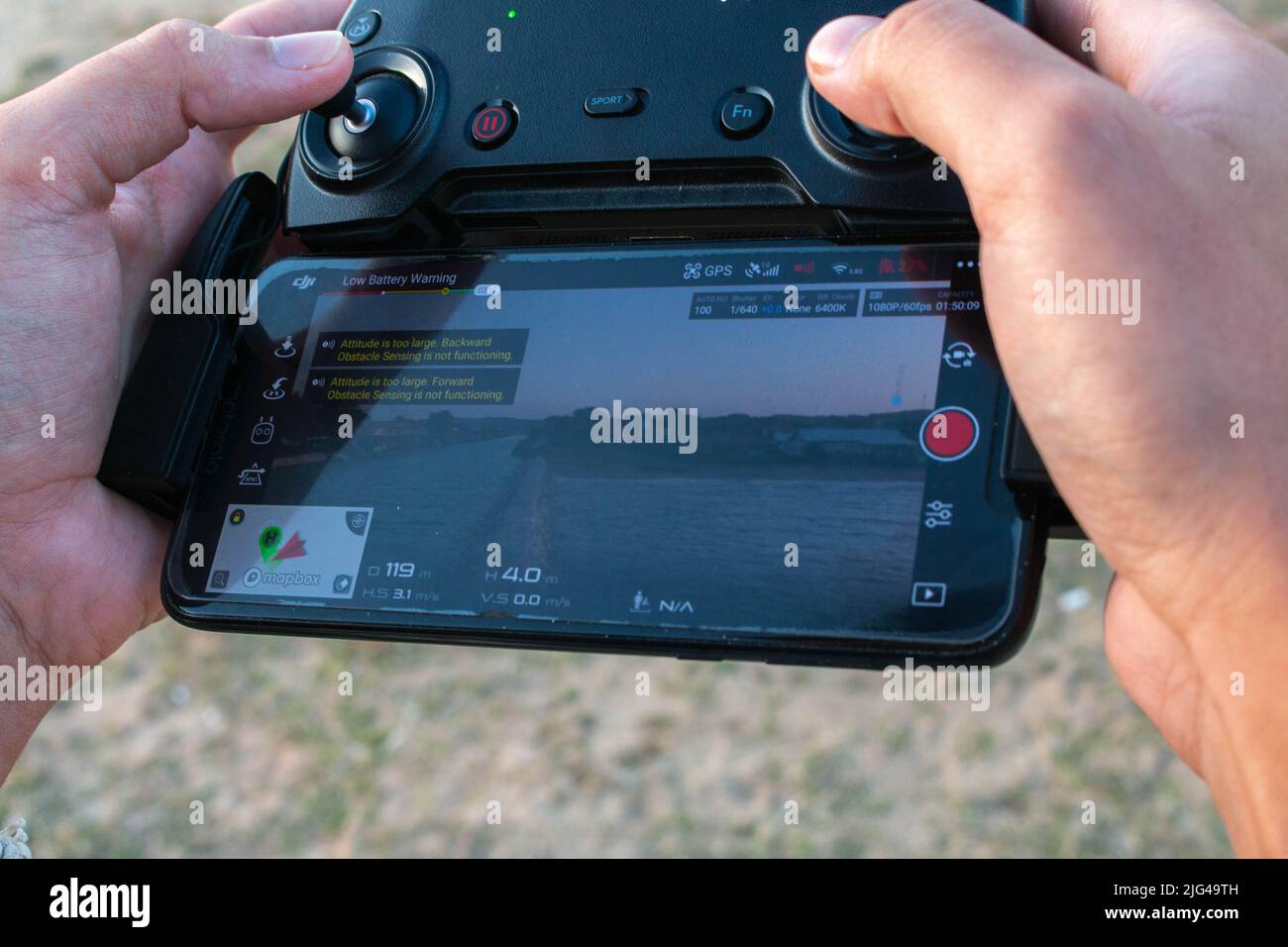 manly hands using a drone on the beach Stock Photo - Alamy