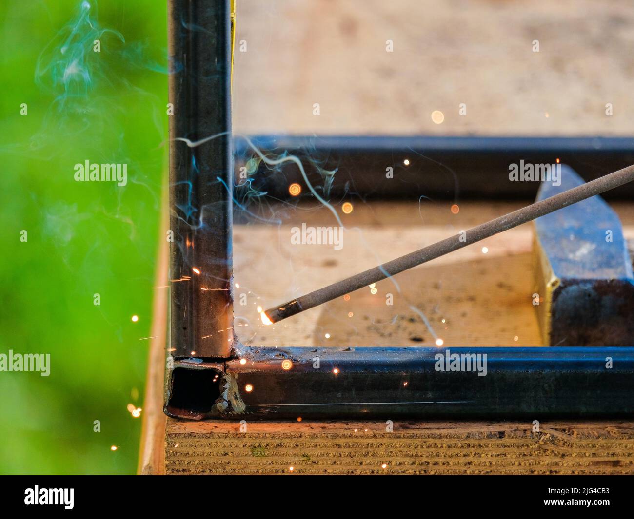 The tip of a hot electrode for electric arc welding. Selective focus ...