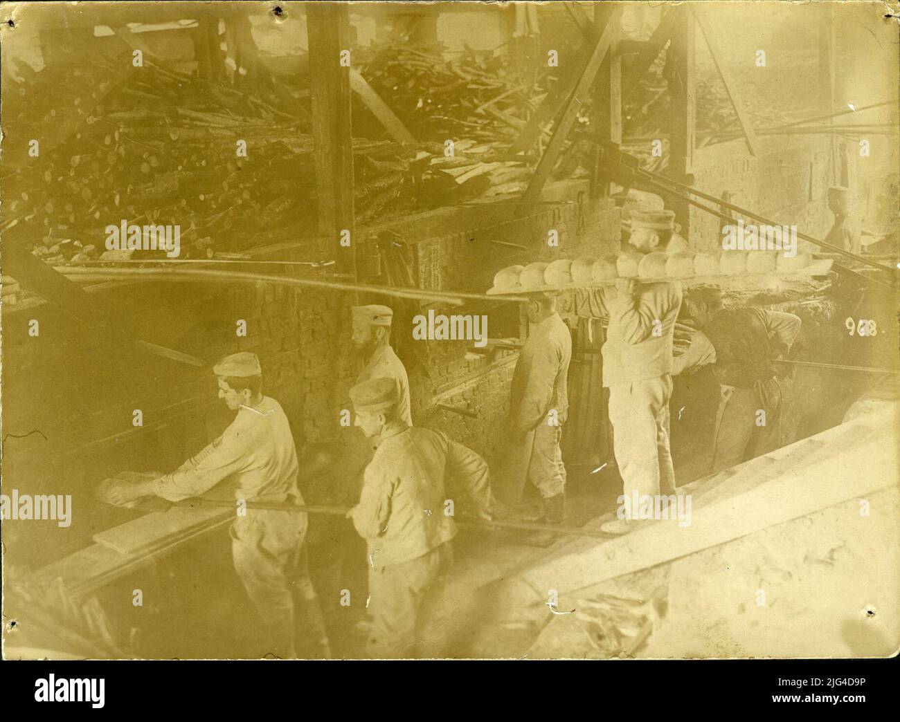 German field bakery on the western front. Insert the bread in the oven ...