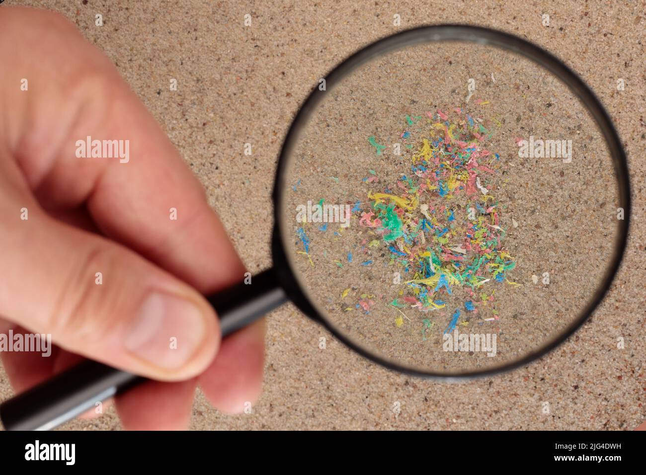 Micro plastic under magnification, magnifying glass. Invisible micro ...