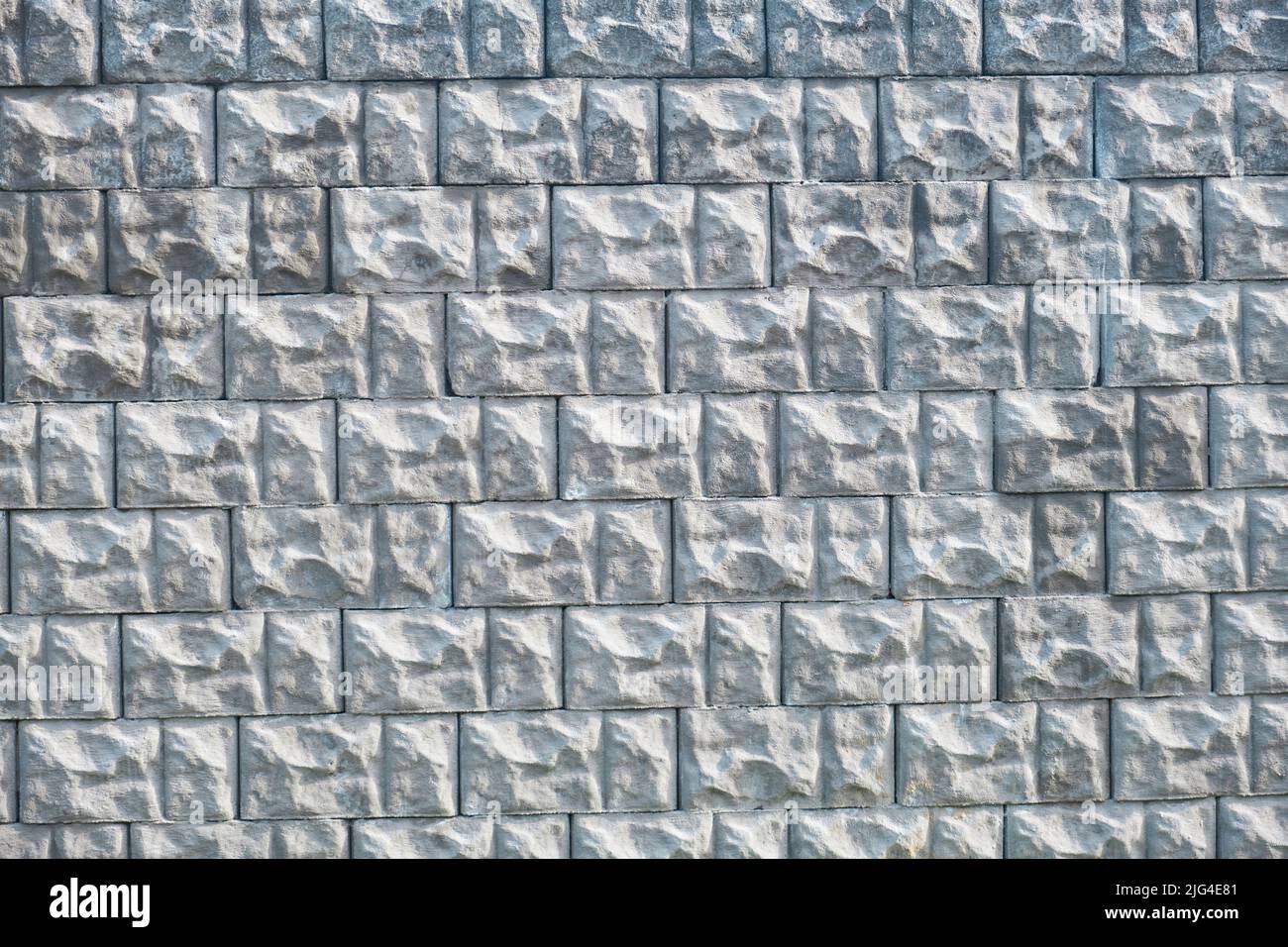 Pattern and texture background of old stone wall covered with clumps of ...